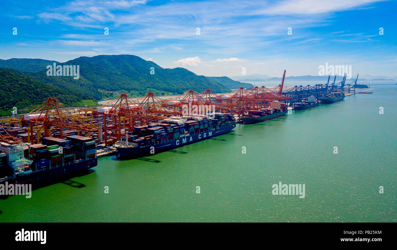Aerial view of Busan new port of South Korea. Container ship in import ...