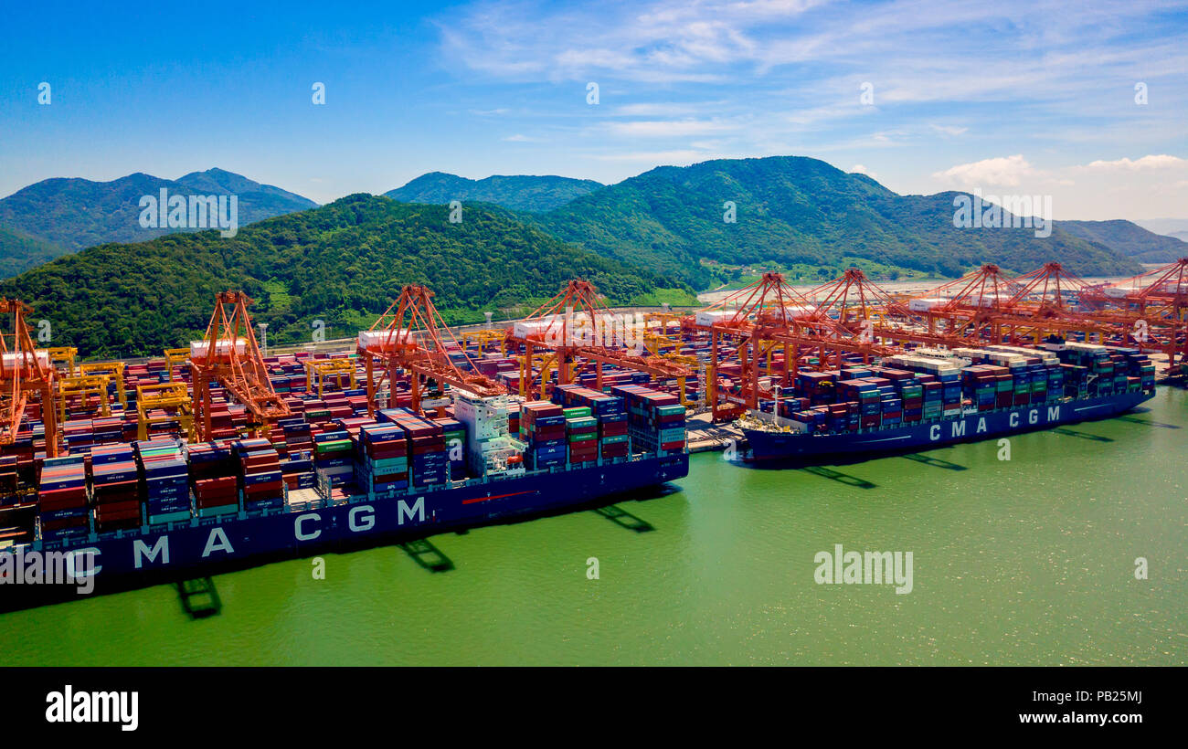 Aerial view of Busan new port of South Korea. Container ship in import ...