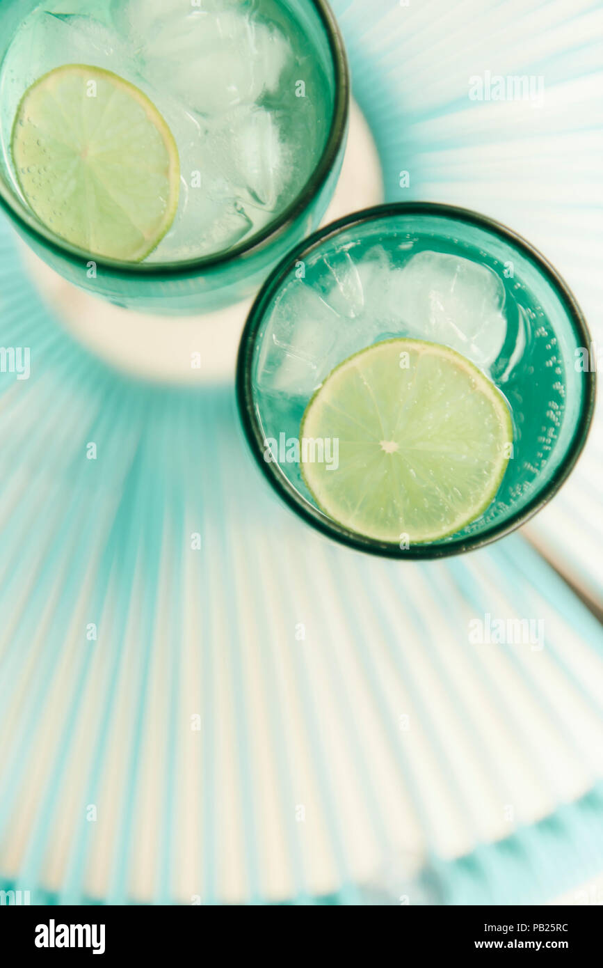 A couple of refreshing fizzy drinks with lime slices in summer Stock ...