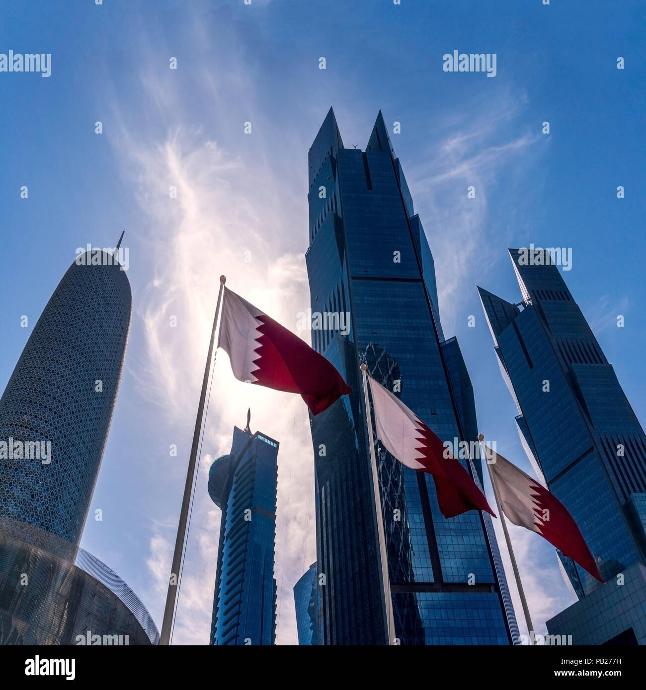 Qatar Flags Sailing Surrounded with Modern Blue High Skyscrapers in ...