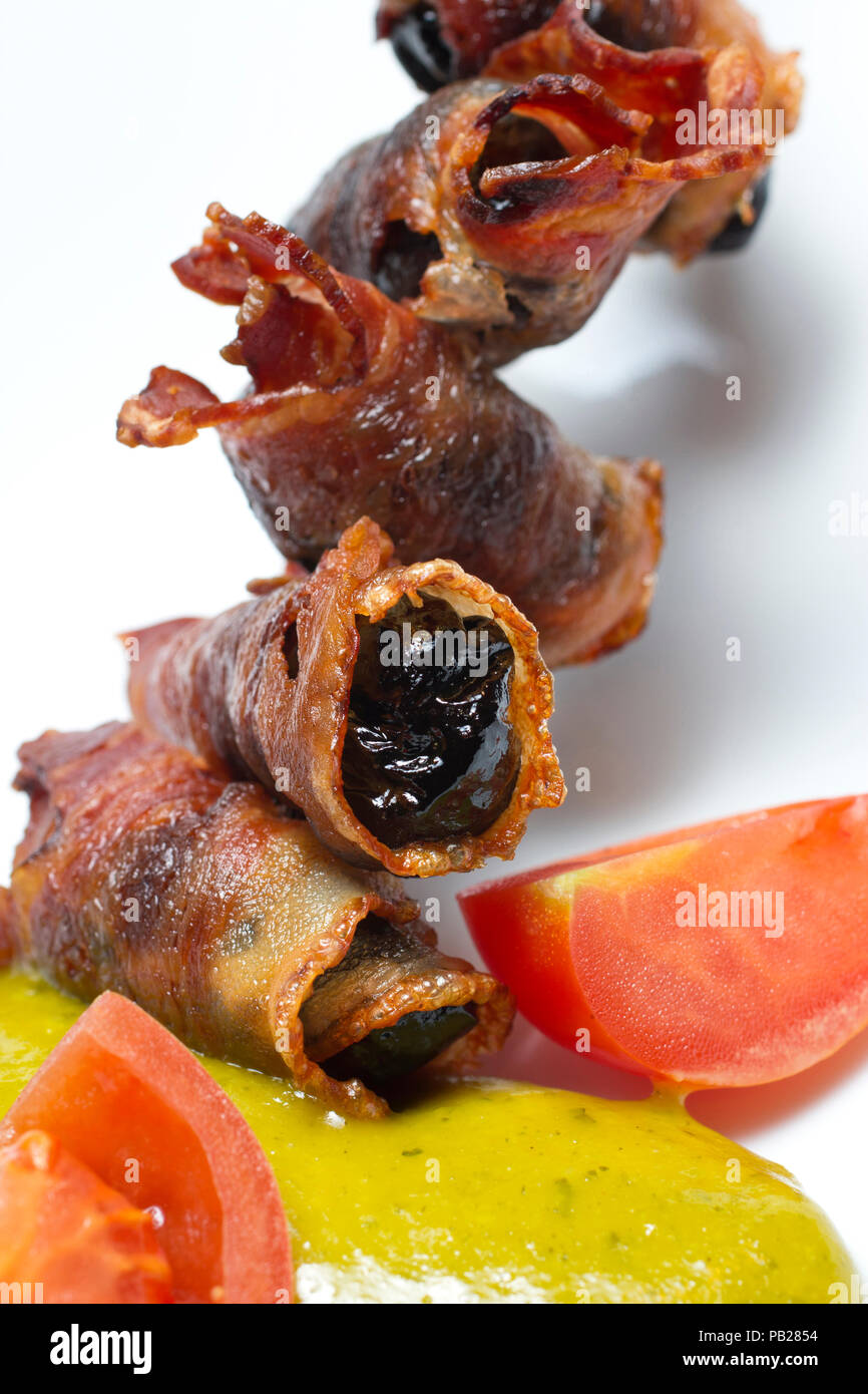 Proons wraped in smoked bacon - appetizer, detail photography macro ...