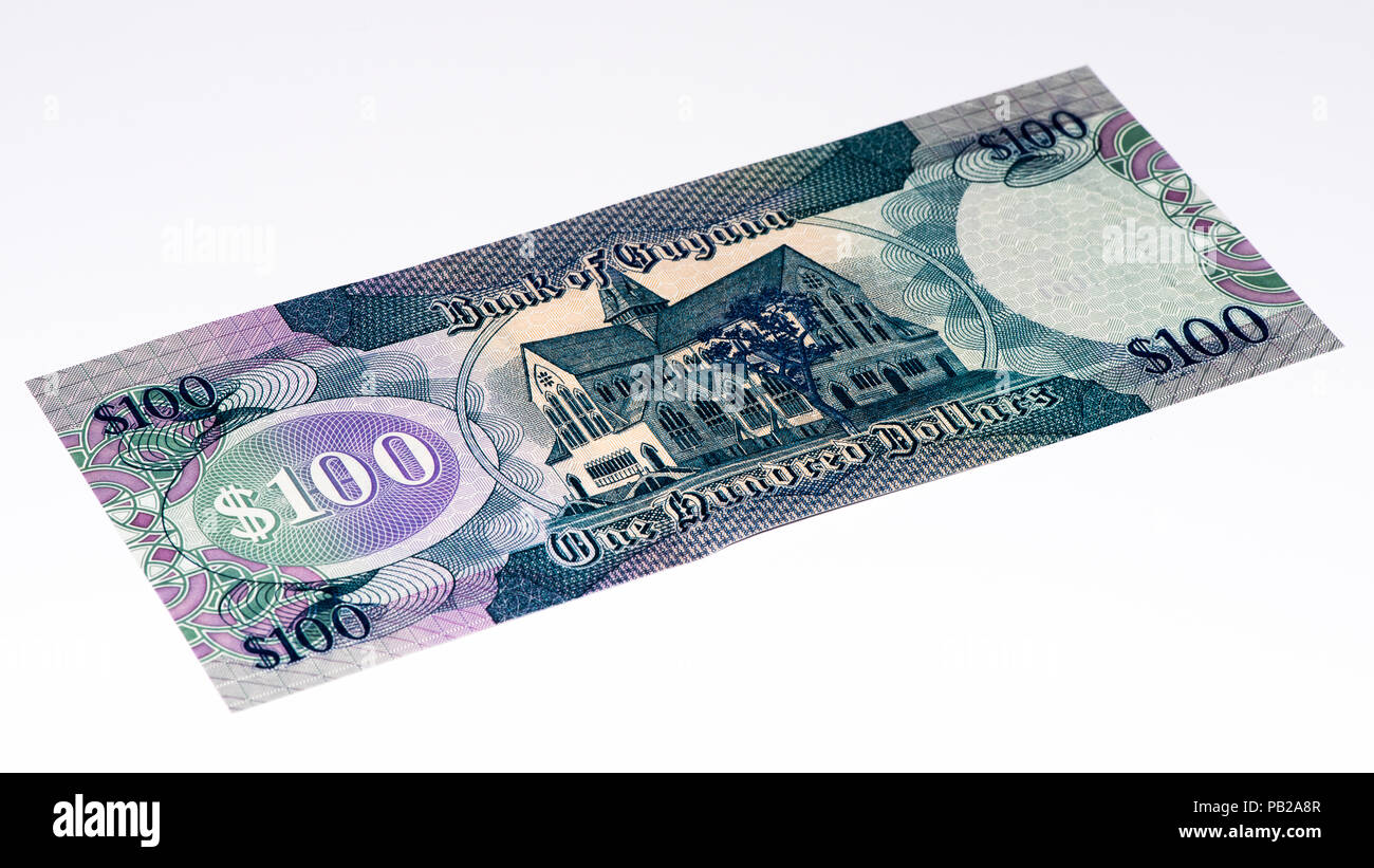 100 Guyanese dollars bank note. Guyanese dollar is the national ...
