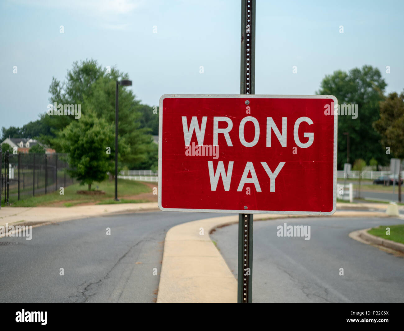 Wrong way red sign at a local neighborhood driveway with space to the ...