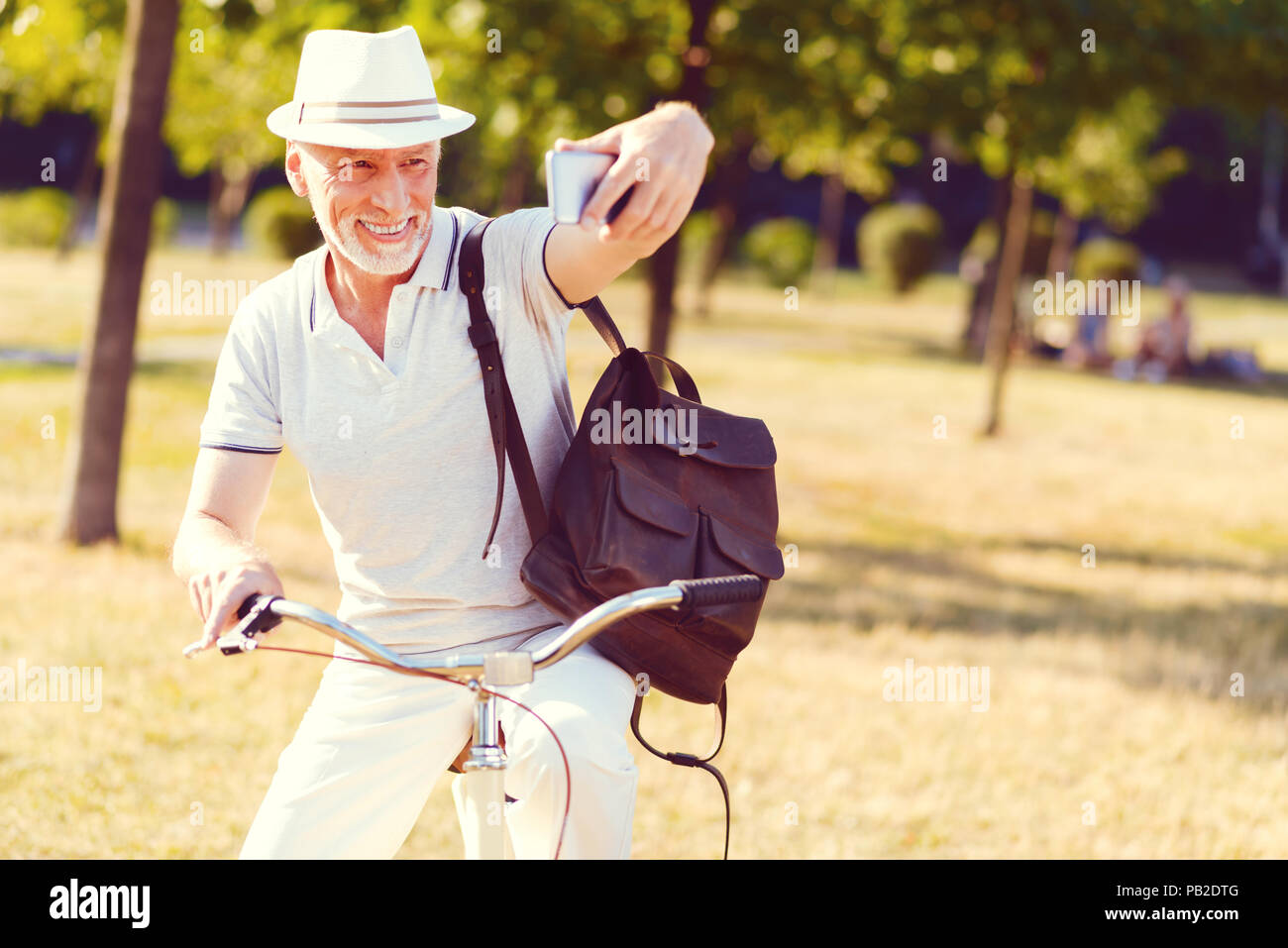Extremely happy senior gentleman posing for selfie outdoors Stock Photo ...