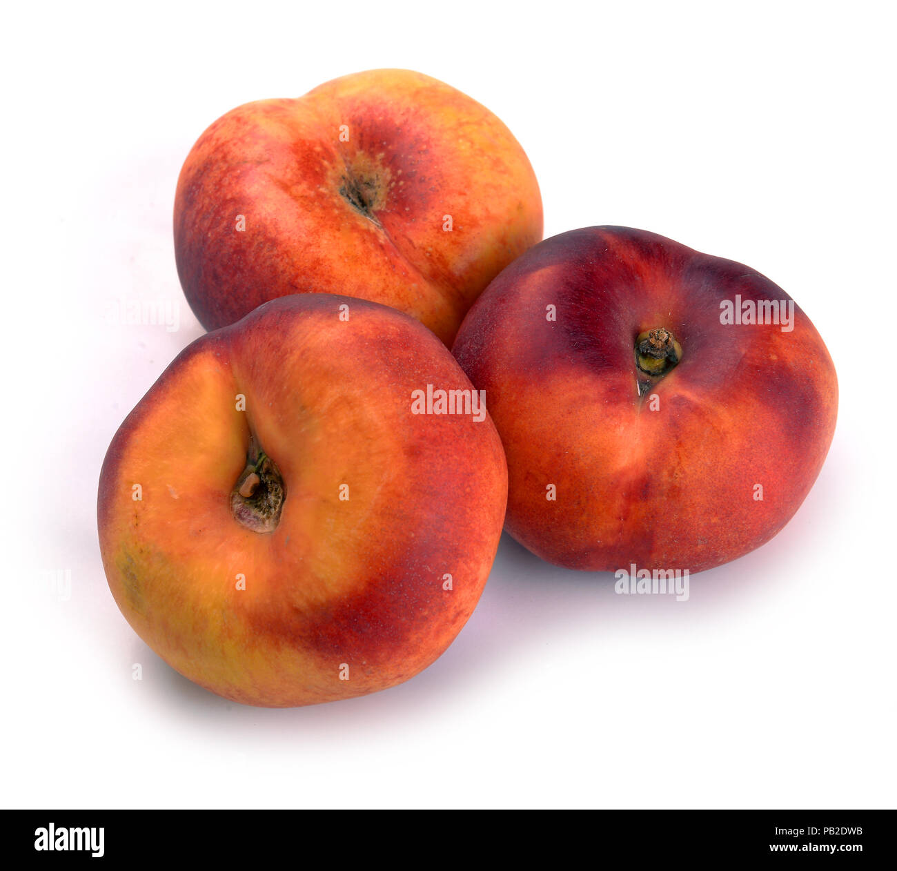 Chinese flat peaches nectarine on a white background Stock Photo - Alamy