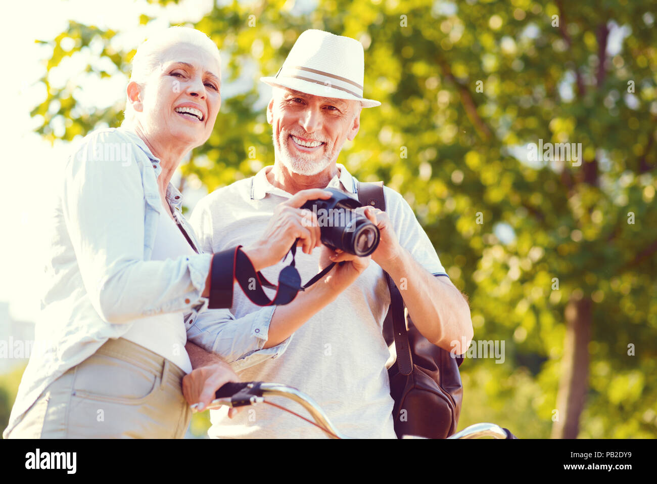 Extremely happy retired couple smiling after family photoshoot Stock ...