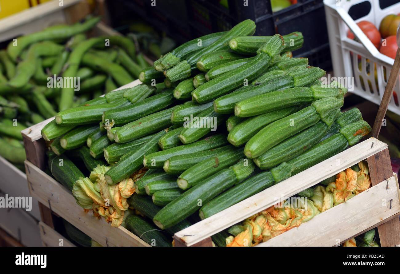 zucchini in a wooden box on the market Stock Photo - Alamy