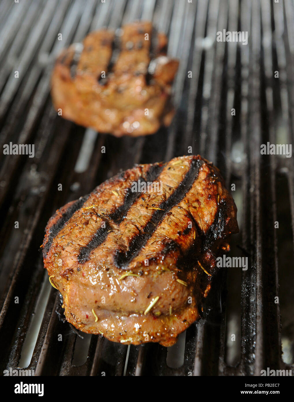 beef steak cooking on an open flame grill Stock Photo - Alamy