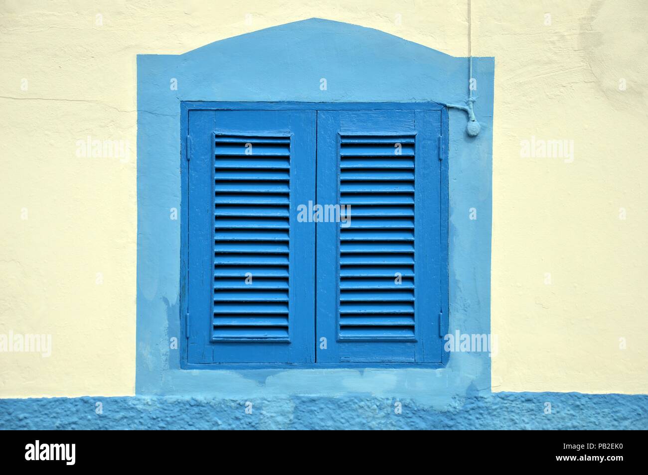 light blue window of a greek white house Stock Photo - Alamy