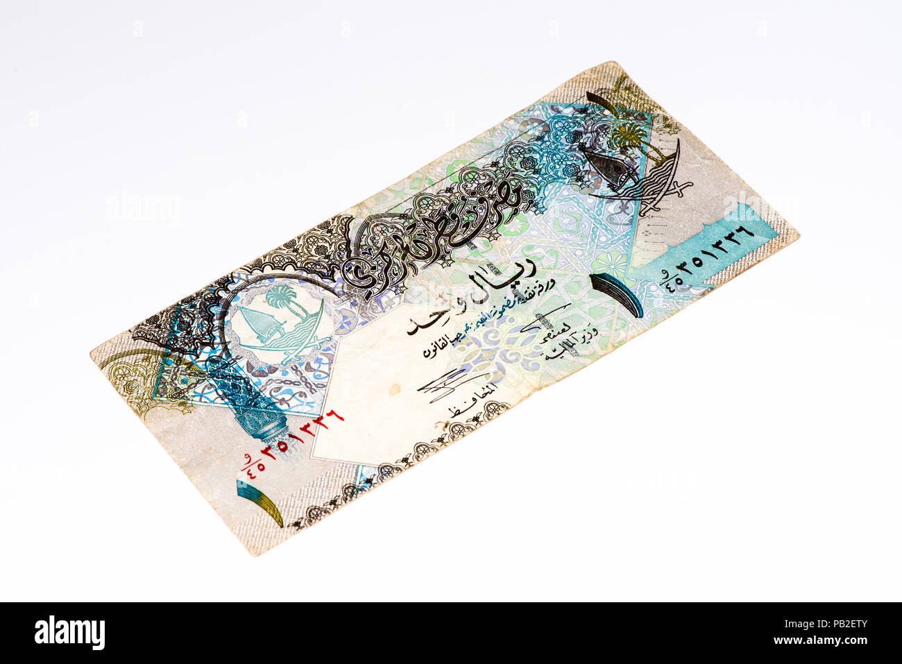 1 Qatari riyal bank note. Riyal is the national currency of Qatar Stock ...