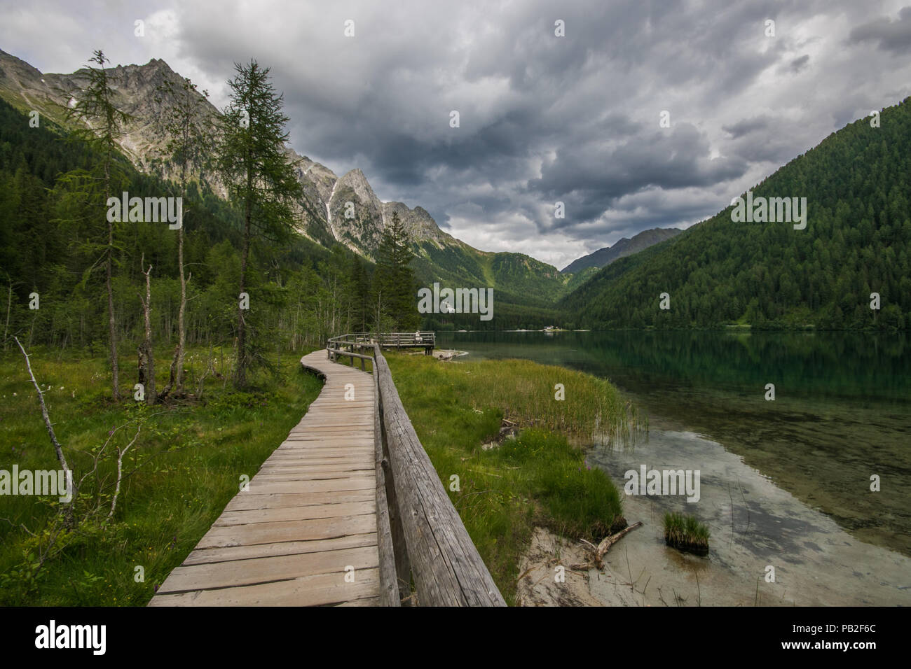 Wooden pathway near Anterselva lake Stock Photo - Alamy