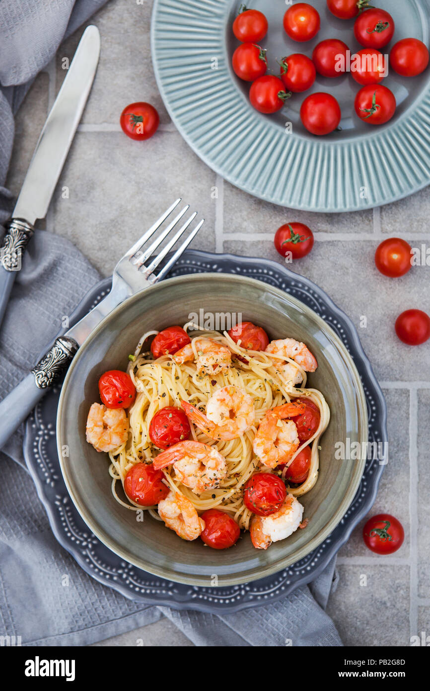 Spaghetti with prawns and cherry tomatoes, top view Stock Photo - Alamy