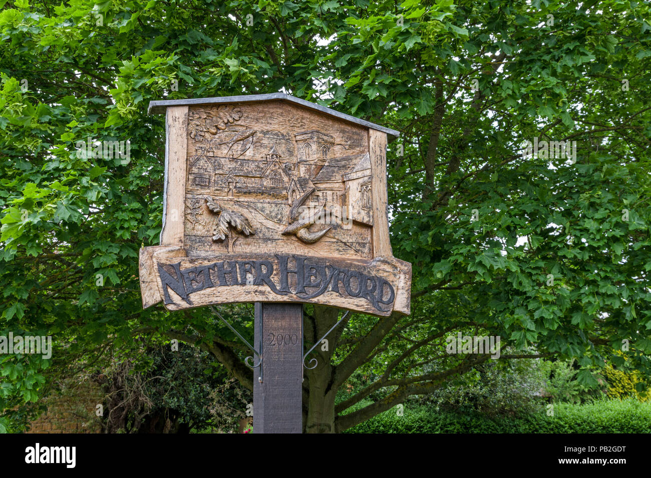 Carved wooden village sign for Nether Heyford, Northamptonshire, UK ...