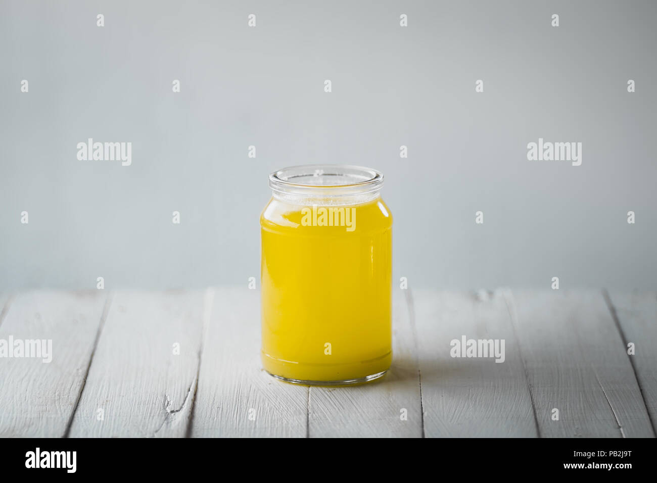 Pineapple juice In a glass bottle White wood background Stock Photo - Alamy