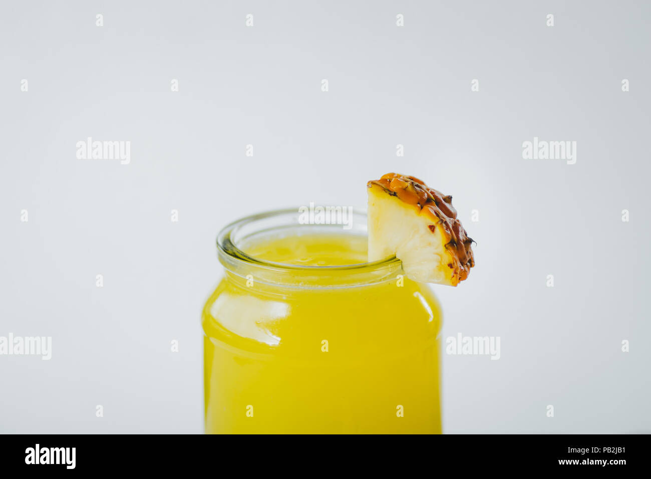 Pineapple juice In a glass bottle White wood background Stock Photo - Alamy