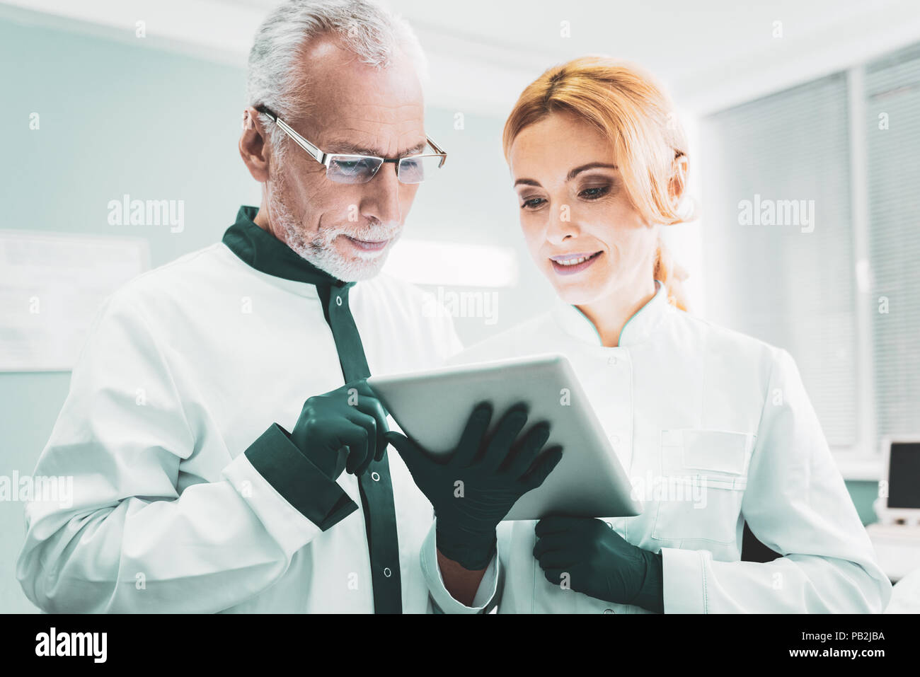 Two successful scientists checking the results of research Stock Photo ...