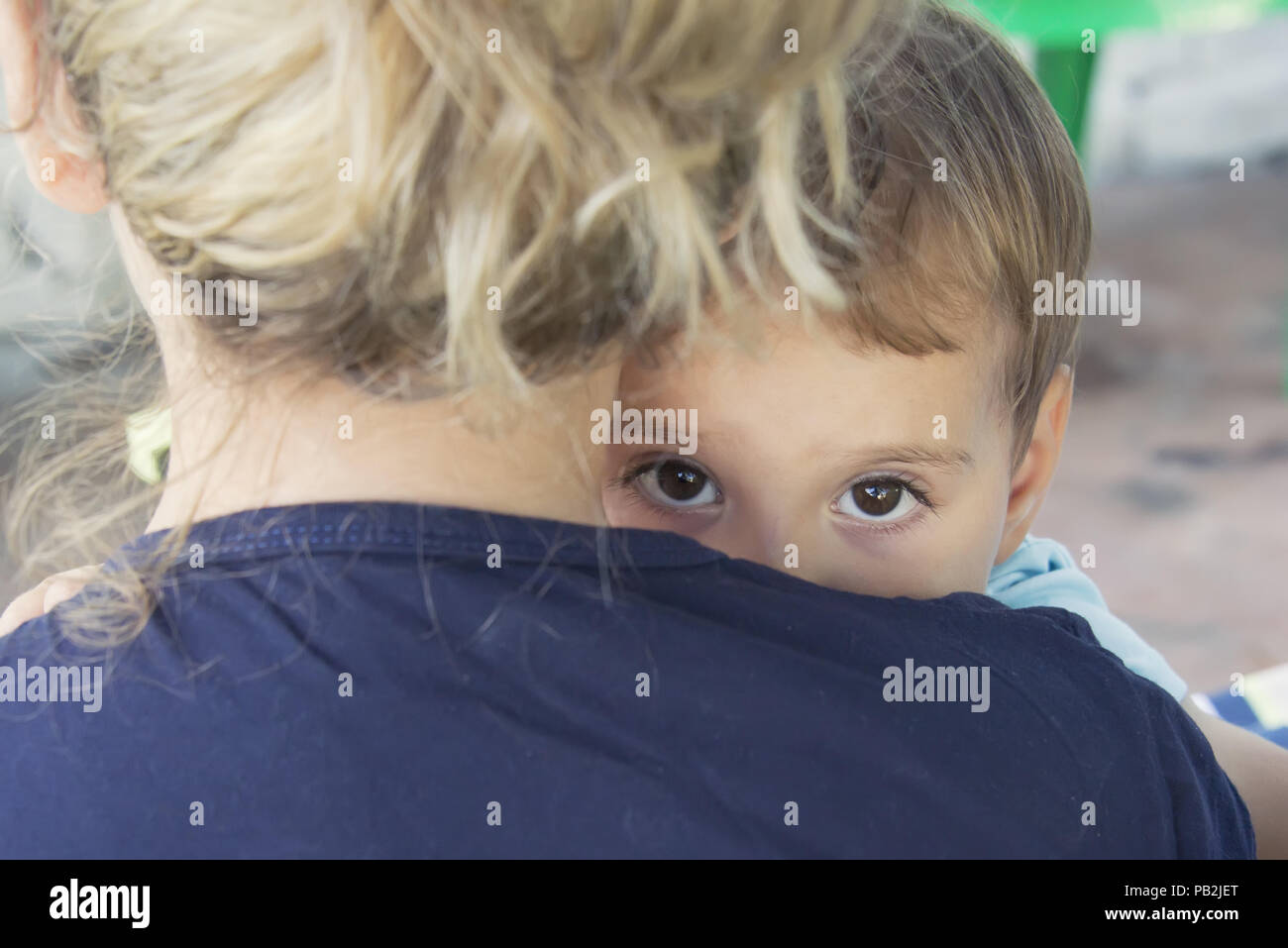 Frightened mother hugs child hi-res stock photography and images - Alamy