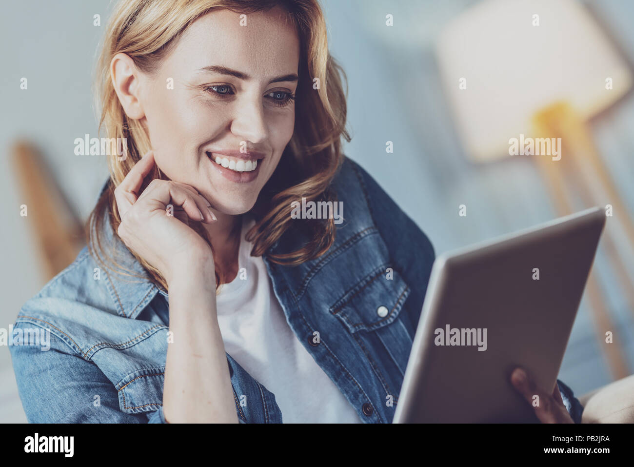 Portrait of delighted woman that using tablet Stock Photo - Alamy