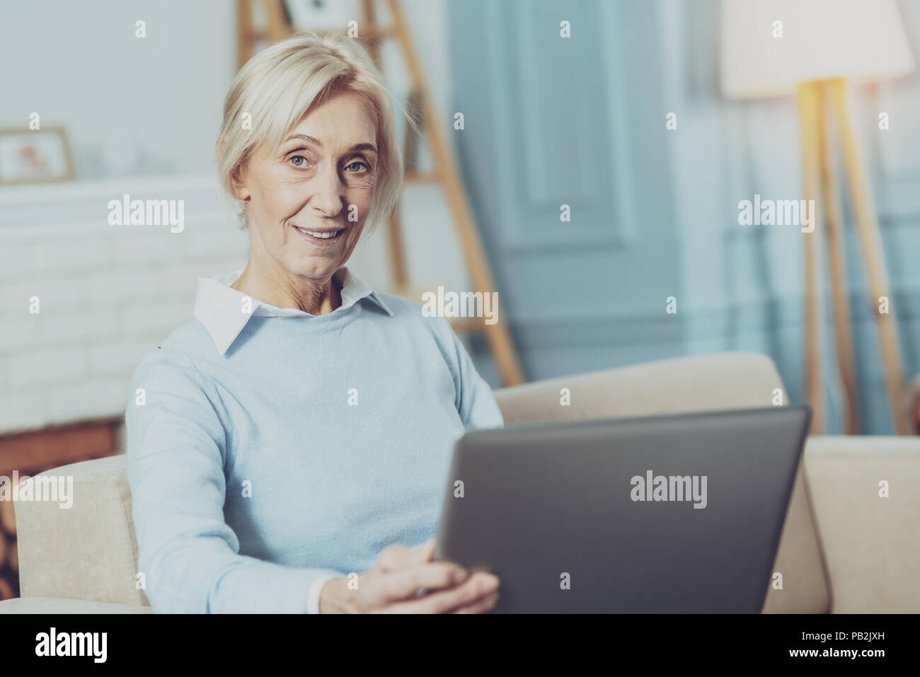 Cheerful retirement using her personal computer Stock Photo - Alamy