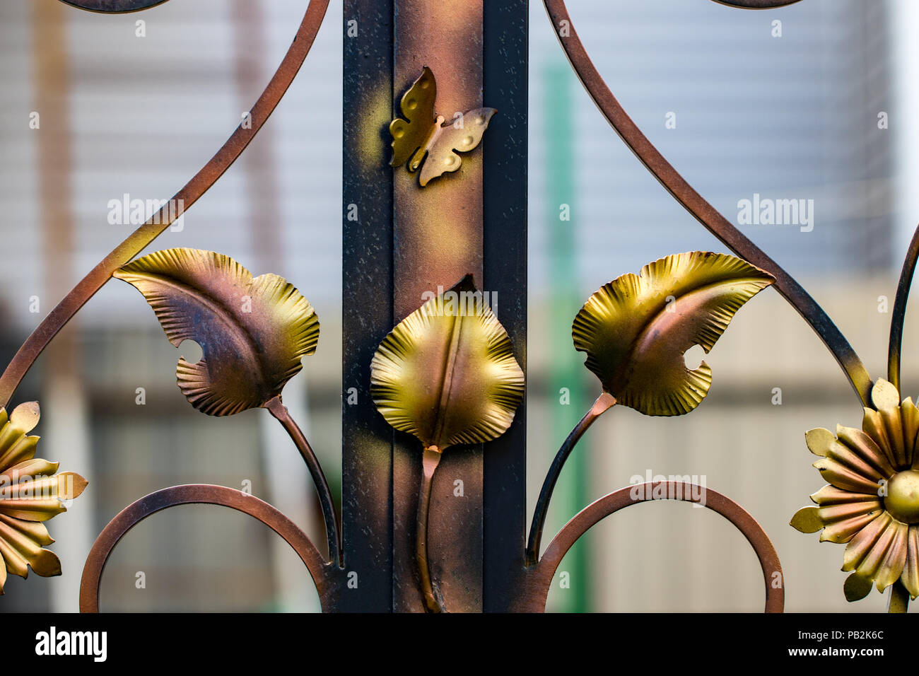 ornate wrought-iron elements of metal gate decoration Stock Photo - Alamy