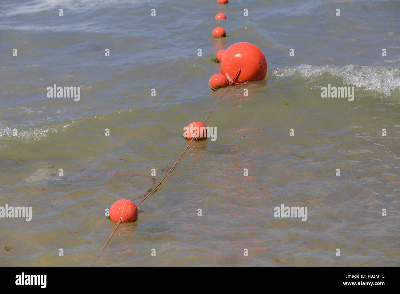 Red buoys in the open sea on a sunny day Stock Photo - Alamy