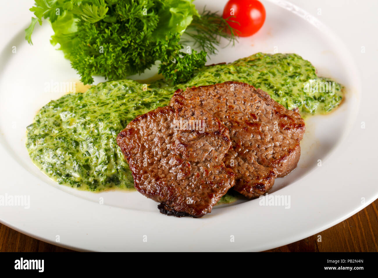 Beef with spinach mousse Stock Photo - Alamy