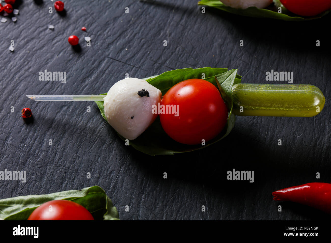 Canape caprese with olive oil Stock Photo - Alamy