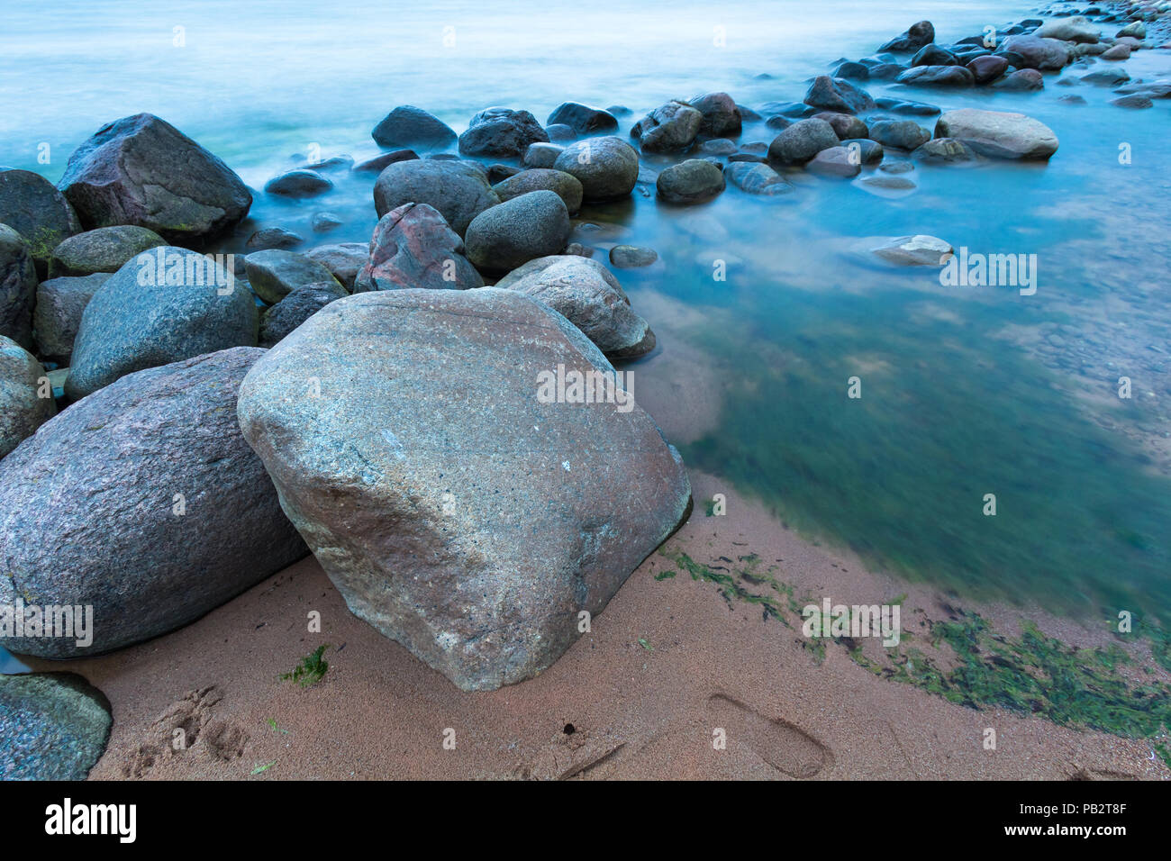 Stones In The Sea Stock Photo - Alamy