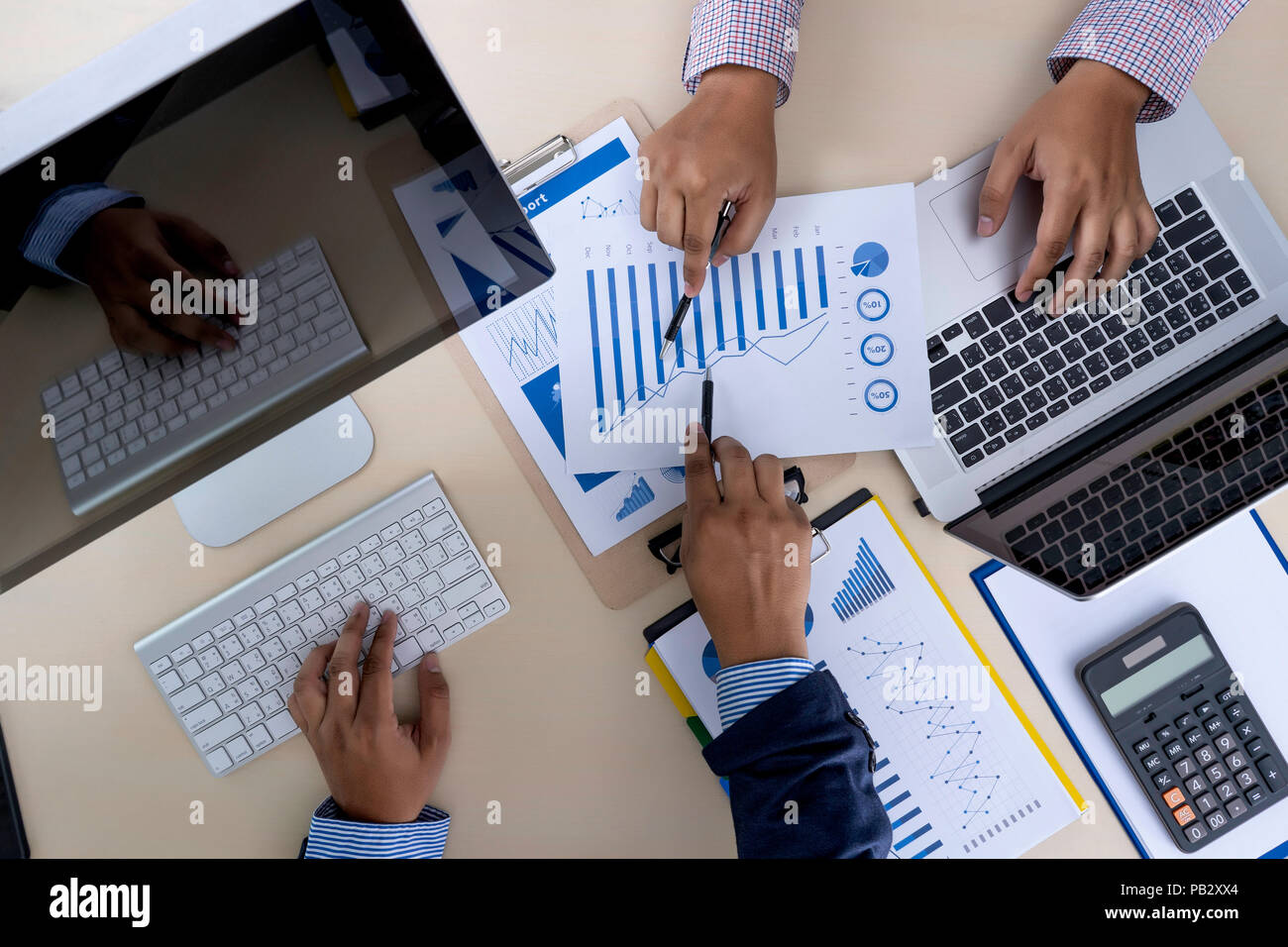 teamwork reports accounting concept analyzing financial Stock Photo - Alamy