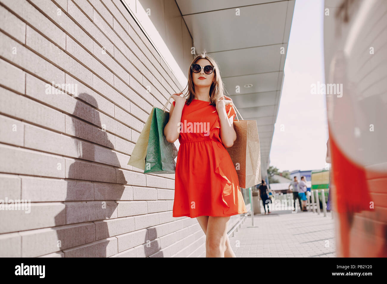 two beautiful young women walk to the shops and make purchases Stock ...
