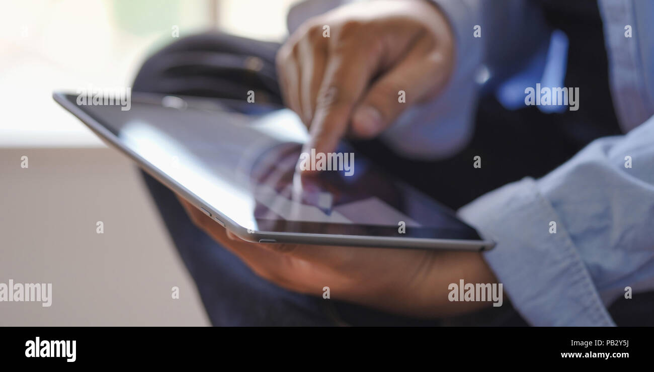 Digital tablet computer close up man using tablet hands man ...