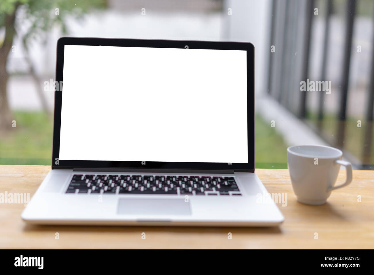 mock up Using laptop with blank screen computer modern Stock Photo - Alamy