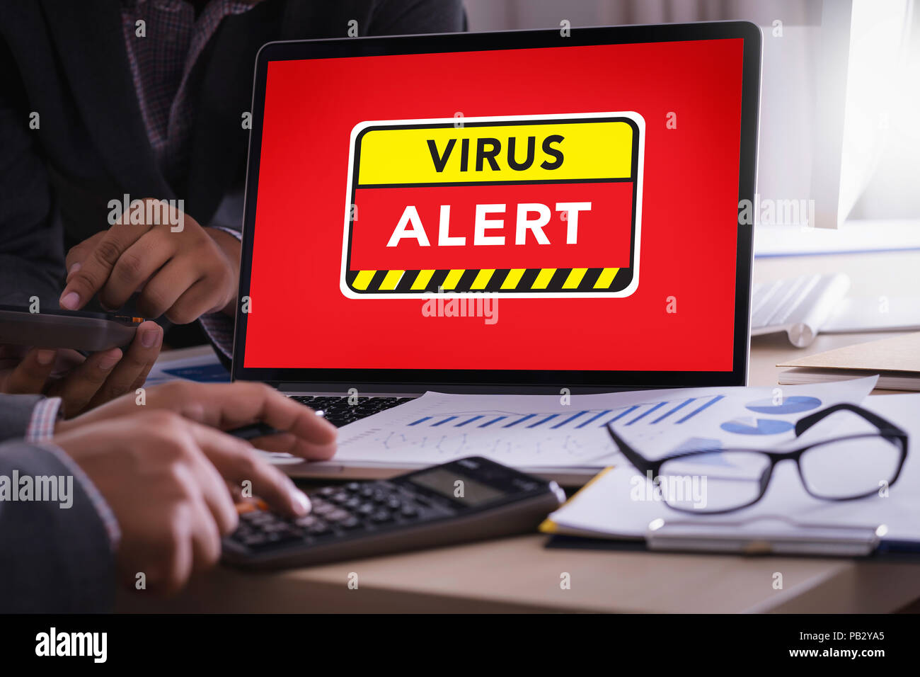 Hacker Protection Concept Man working on laptop Virus Detected Alert ...