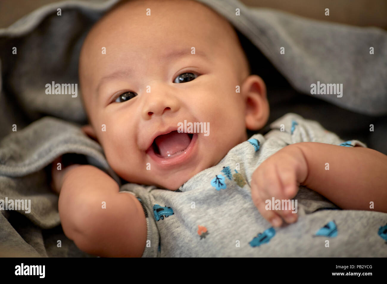 Cute 3 month old baby boy smiling with shallow depth of field Stock ...