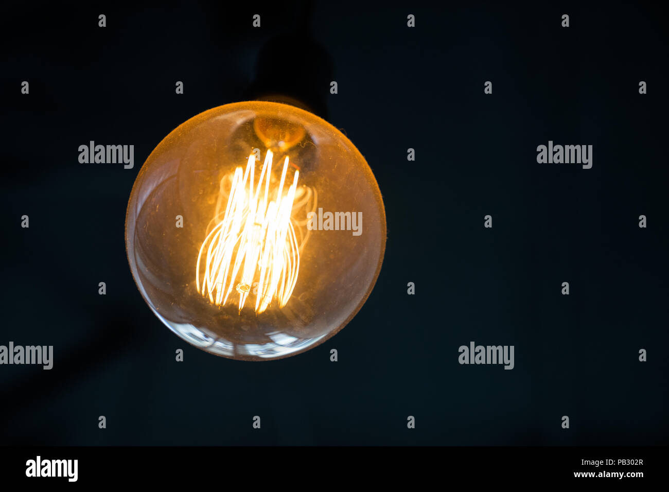 hang Round yellow light lamp or lantern on dark background with copy ...