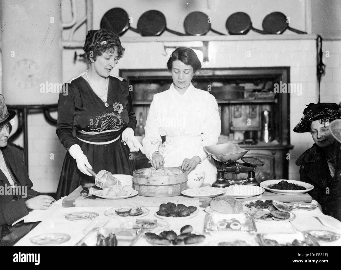 Official photograph showing women in a kitchen baking Stock Photo - Alamy