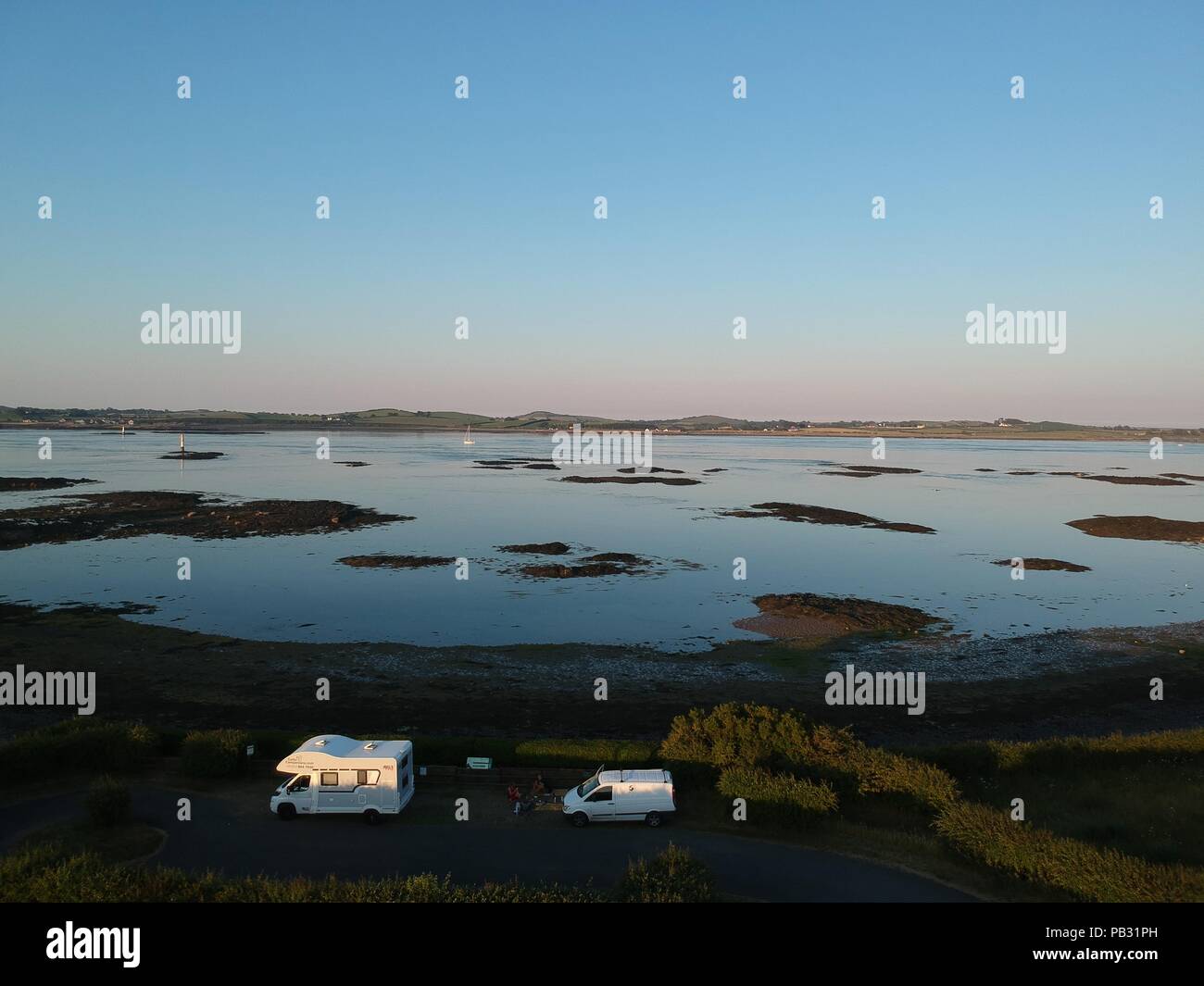 Campers by sunrise in Northern Ireland. Drone picture Stock Photo - Alamy