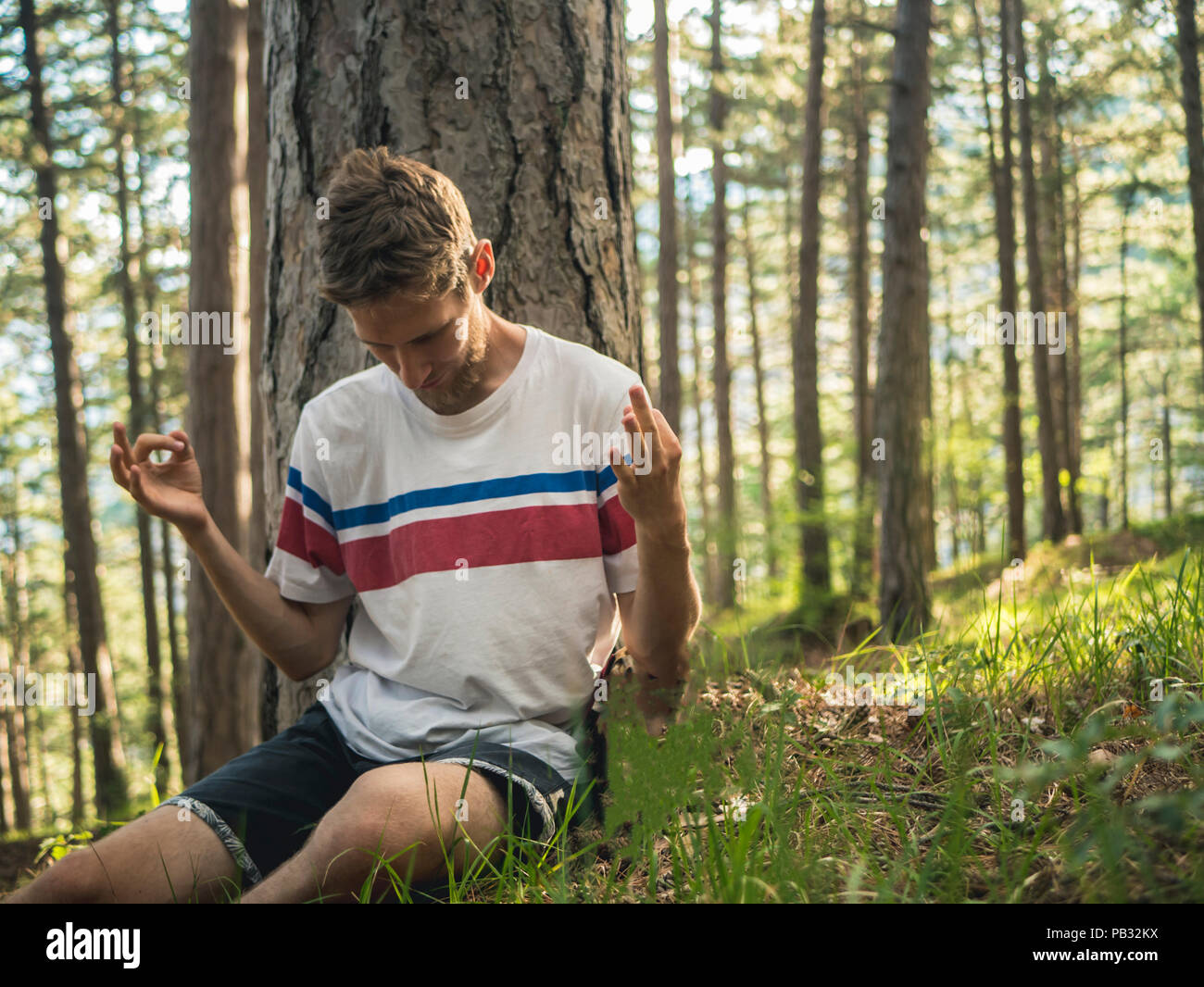 Meditate relax tree under one hi-res stock photography and images - Alamy