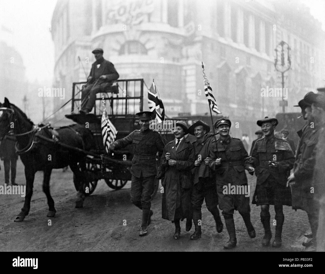 Official photograph showing men celebrating victory as part of a parade ...