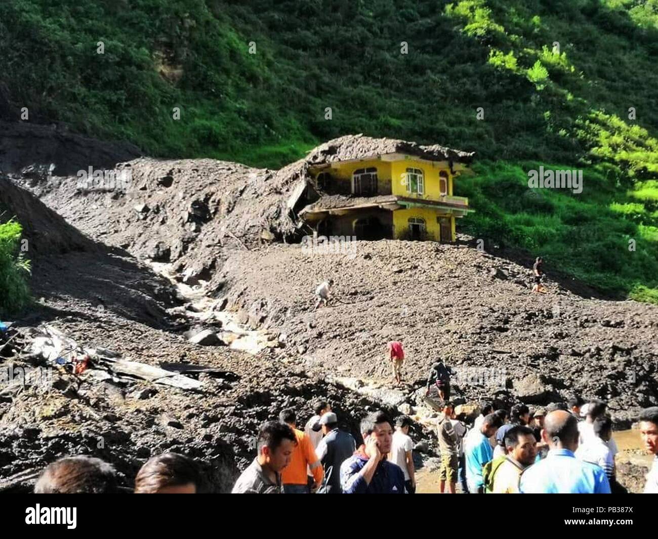Rasuwa. 26th July, 2018. People gather at the site of landslide in ...