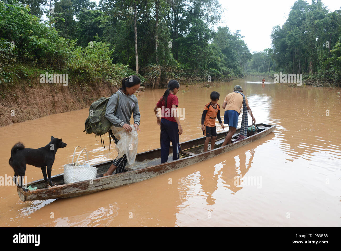 Attapeu, Laos. 26th July, 2018. Villagers row a boat in flood after an under-construction dam ...