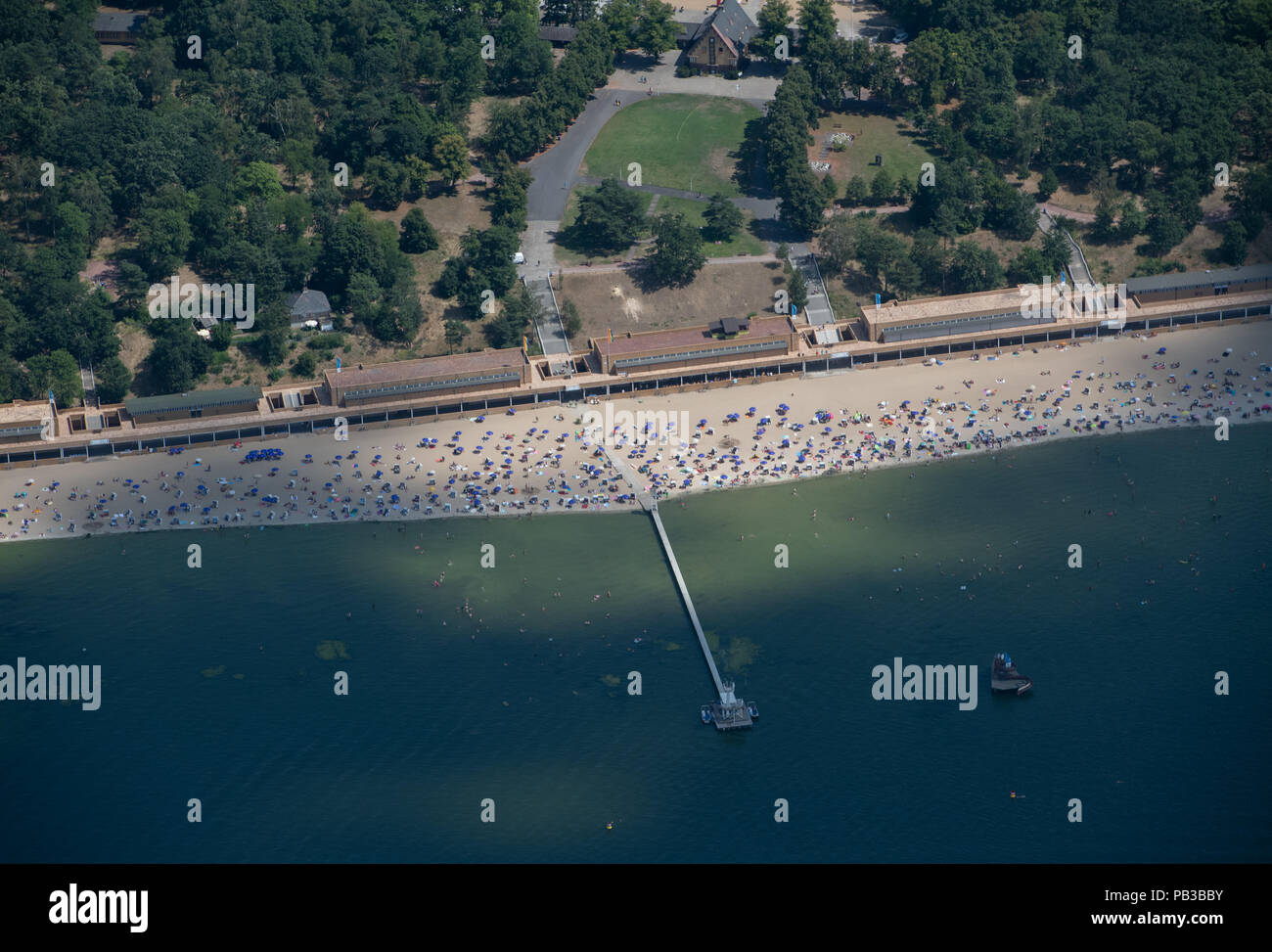 25 July 2018, Germany, Berlin: People enjoy the sun on the beach at ...