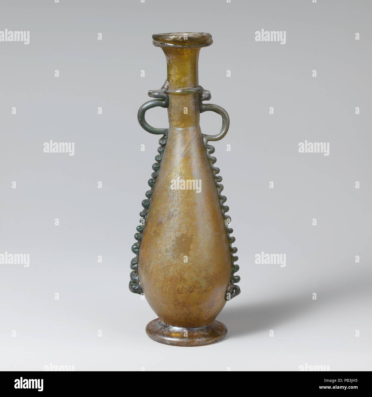 Glass flask. Culture: Roman, Syrian. Dimensions: H. 7 13/16 in. (19.8 ...