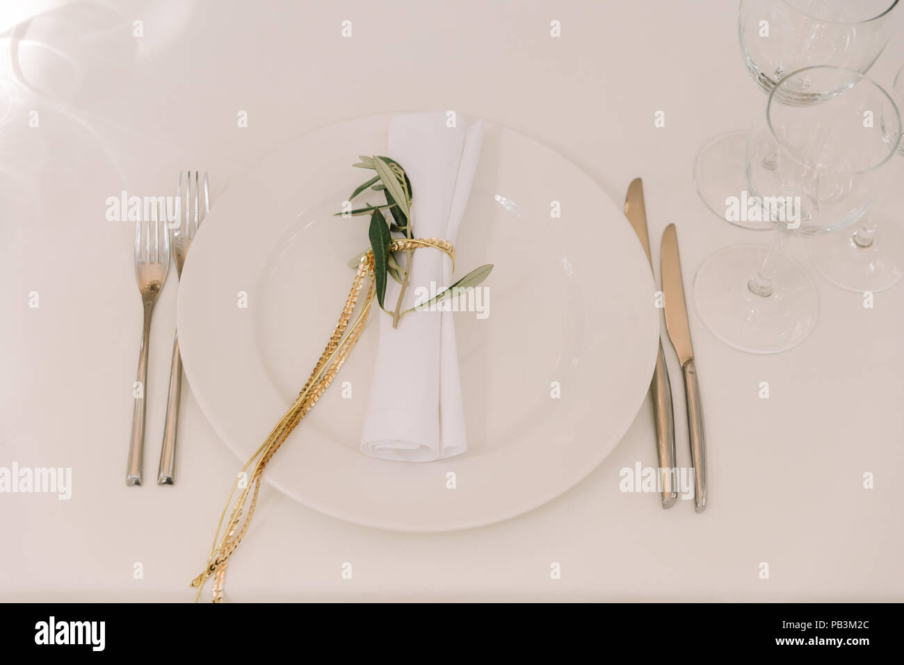 Magnificent decoration of a wedding table and lunch plate. White ware ...