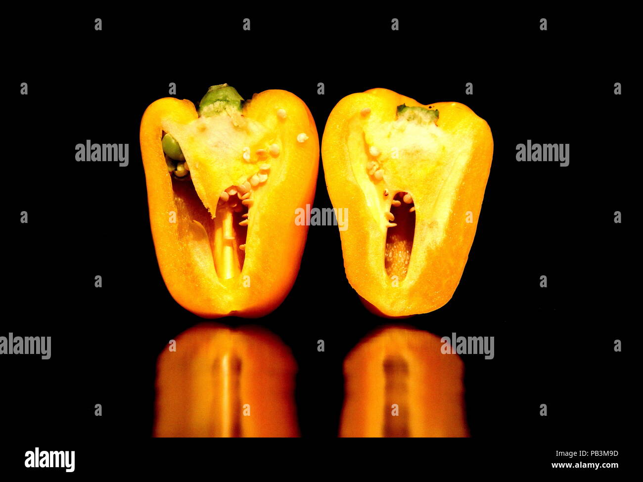 Food and Drink. Bell Pepper. Yellow Pepper cut in two in vertical ...