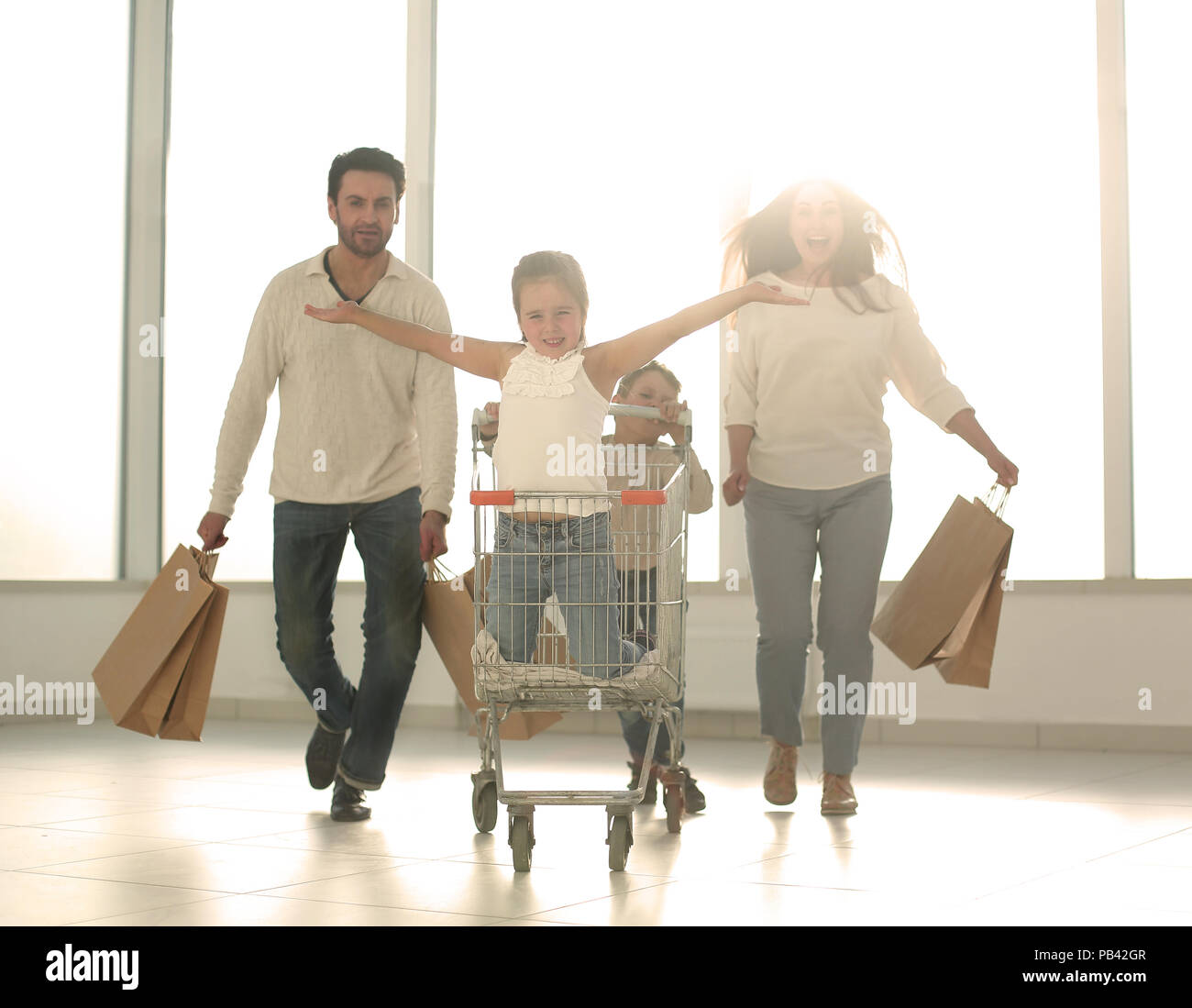 parents with children standing in the hypermarket Stock Photo - Alamy