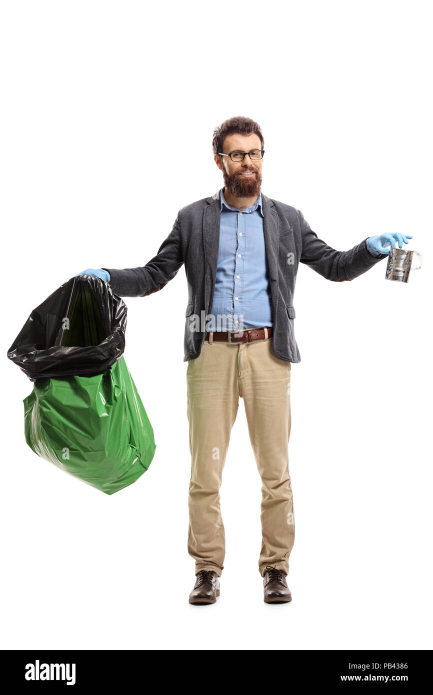 Full length portrait of a young man with a garbage bag and a tin can ...