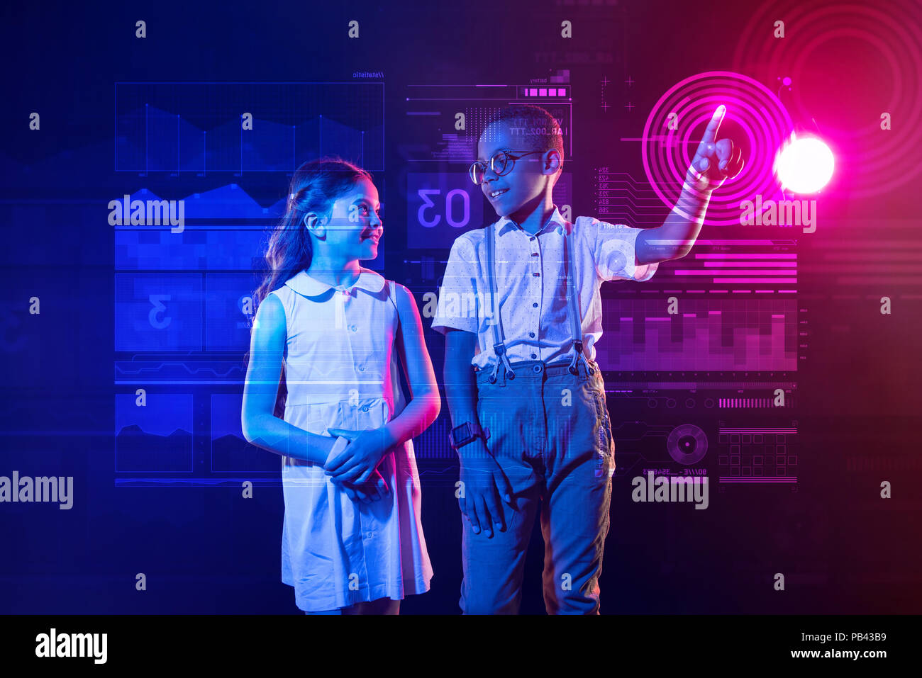 Cute kids smiling while talking Stock Photo - Alamy