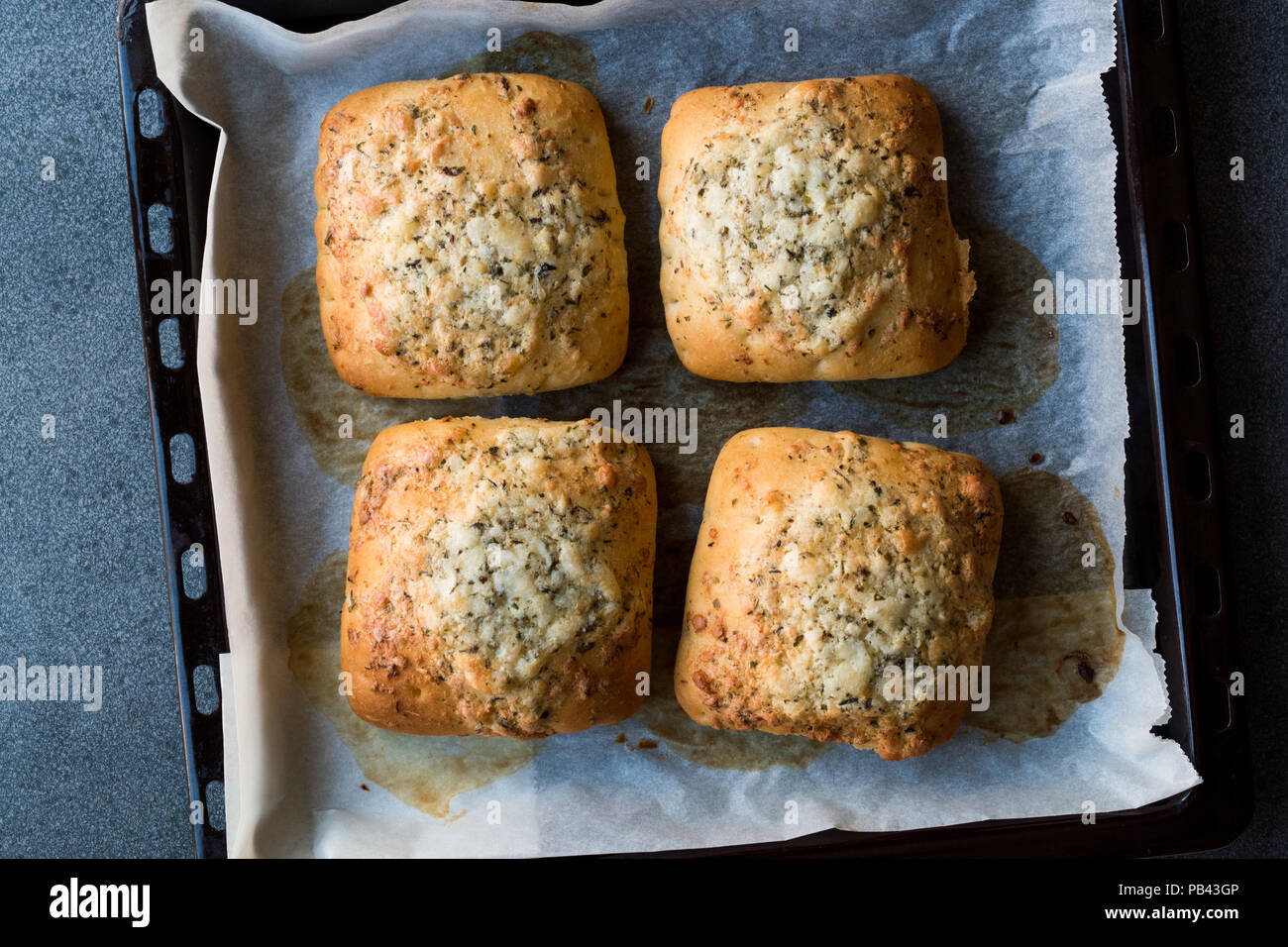 Freshly Baked Square Garlic Bread with Cheese and Herbs in Oven Tray ...