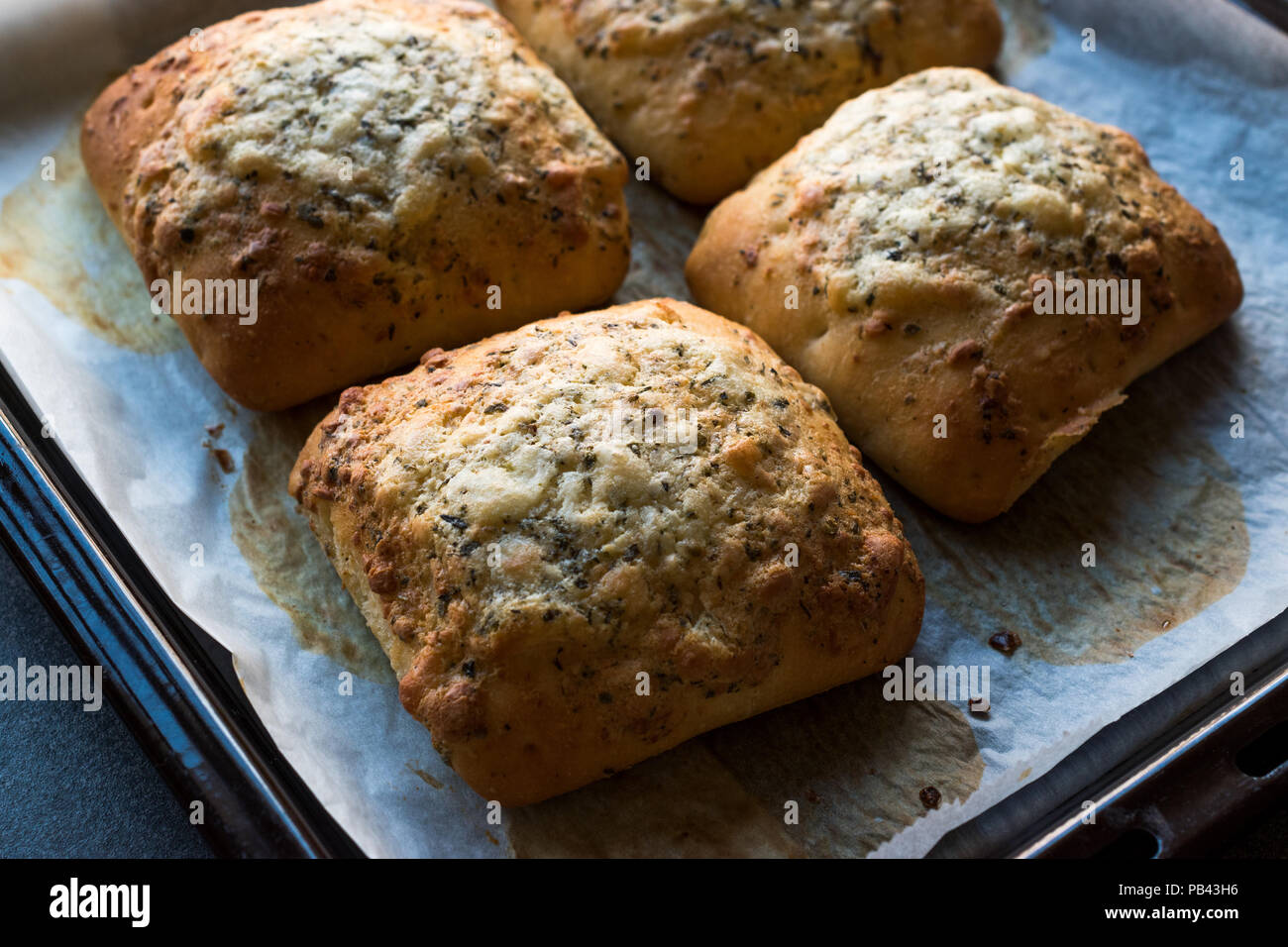 Freshly Baked Square Garlic Bread with Cheese and Herbs in Oven Tray ...